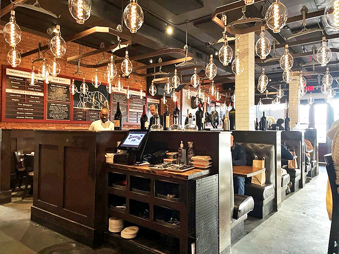The bar at Little Alley isn't just a place to wait&mdash;it's a destination. Those pendant lights create the perfect glow for contemplating life's important questions, like "ribeye or strip?"