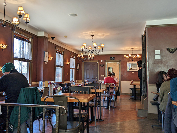 Step inside and you're greeted by warm wood tones, vintage chandeliers, and the unmistakable buzz of happy diners plotting their next bite.