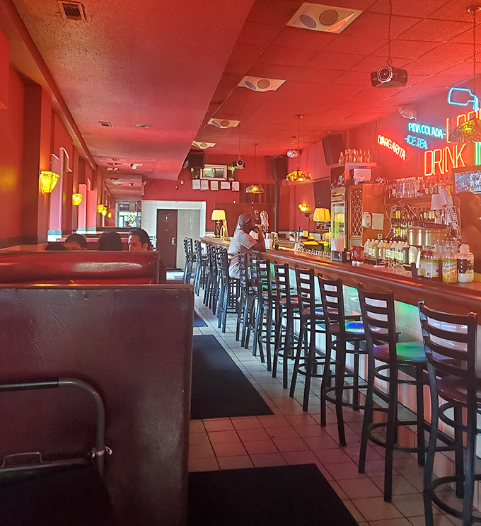 Step inside and the red-hued glow feels like you've entered the VIP section of sandwich heaven, where the bar stools have heard a million Philly stories.