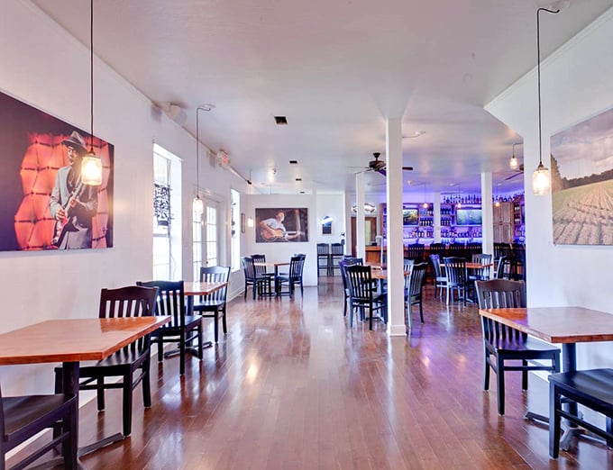 Polished hardwood floors and blues-inspired artwork create the perfect backdrop for the smoky drama about to unfold on your plate.