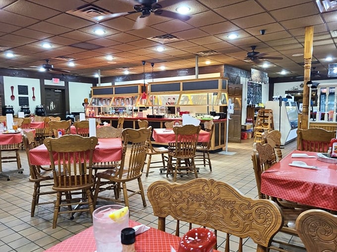 Red-checkered tablecloths and wooden chairs create that perfect "you're about to eat really well" atmosphere that fancy restaurants spend thousands trying to replicate.