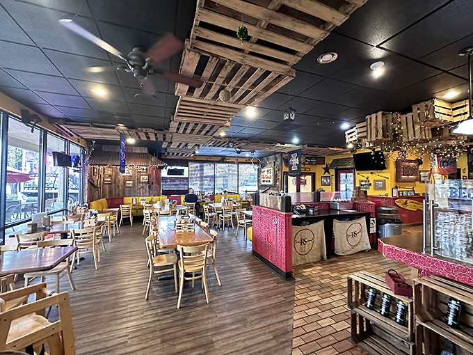 Wooden pallets transformed into ceiling decor? Genius! The rustic-meets-cozy interior feels like the perfect backdrop for serious meat appreciation.