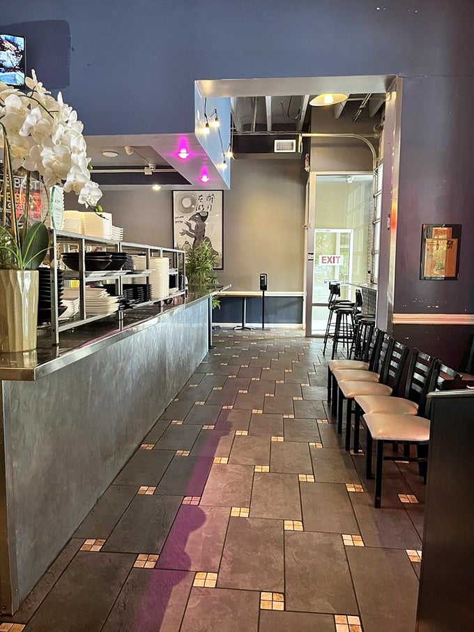 Clean lines, modern lighting, and that subtle pink glow &ndash; the interior says "we're serious about sushi" without shouting it.