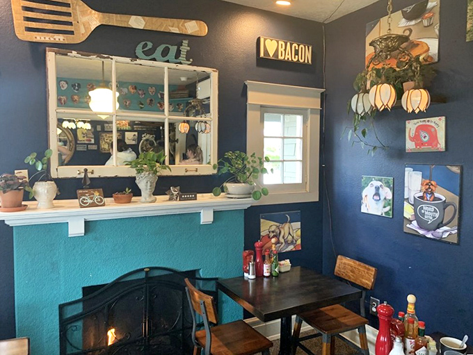 Navy blue walls, quirky art, and an "I ❤️ BACON" sign that speaks universal truth. This isn't decoration&mdash;it's a food philosophy.