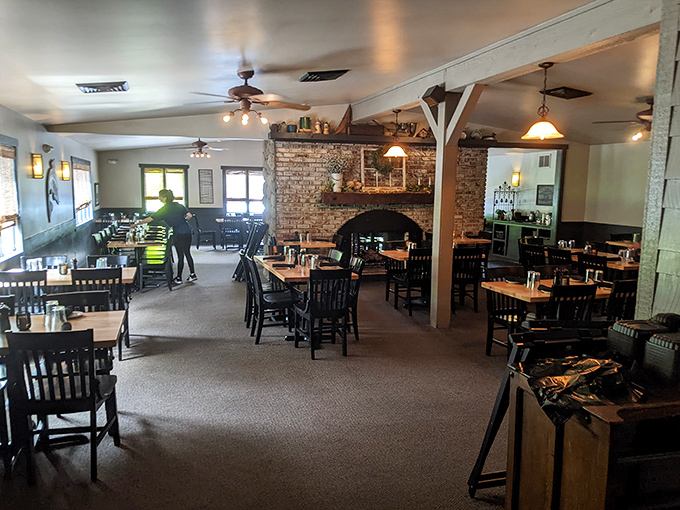 Classic supper club vibes with that brick fireplace that's seen more anniversary dinners than a jewelry store.