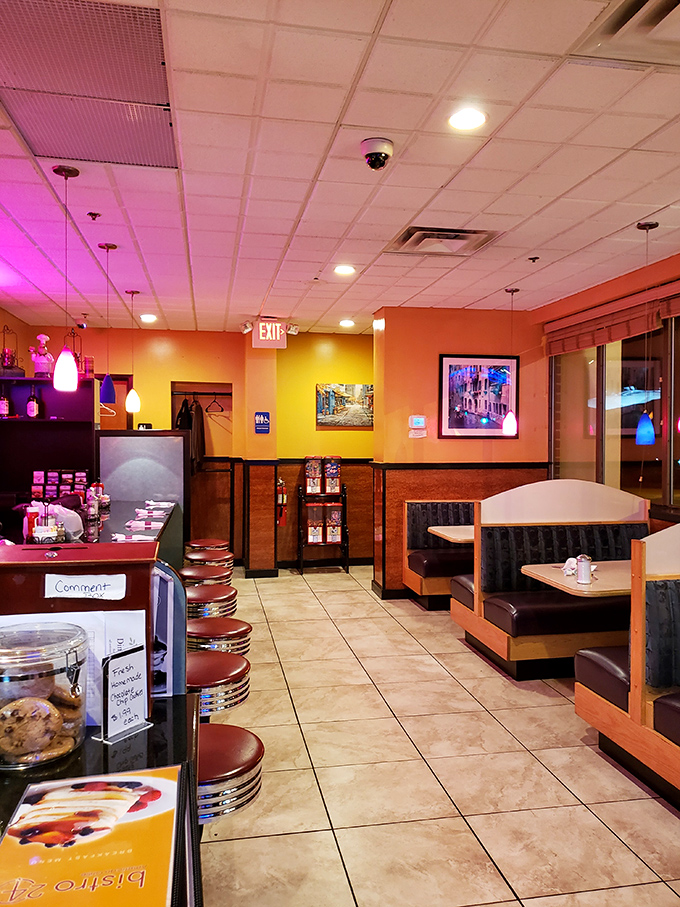 Orange walls and cozy booths create the perfect backdrop for your morning omelet adventure.