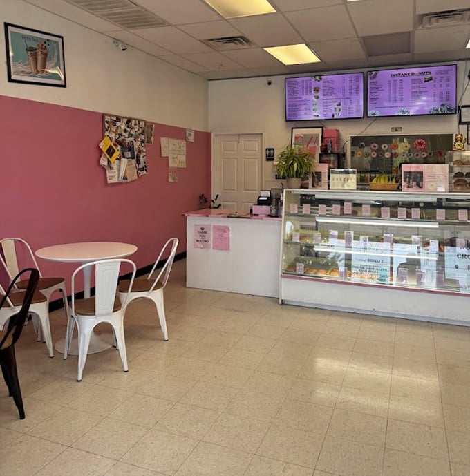 Pink walls and simple tables – proof that fancy decor never made a donut taste better.