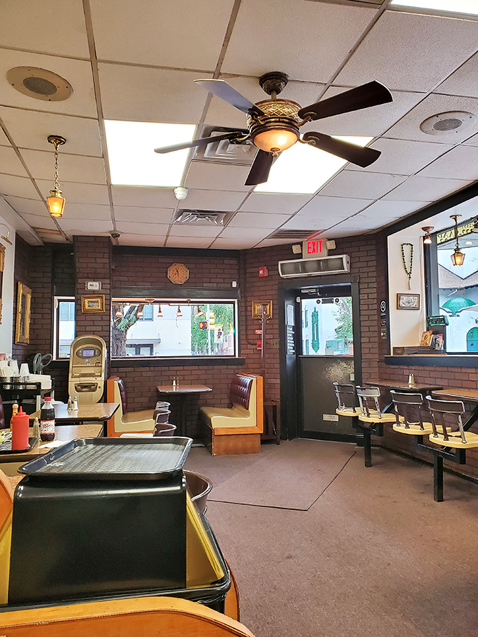 Step inside and discover a dining room where exposed brick meets community spirit, creating instant neighborhood nostalgia.