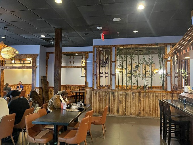 Wooden partitions and bamboo accents transport diners from Louisiana to Tokyo, creating an atmosphere both exotic and welcoming.