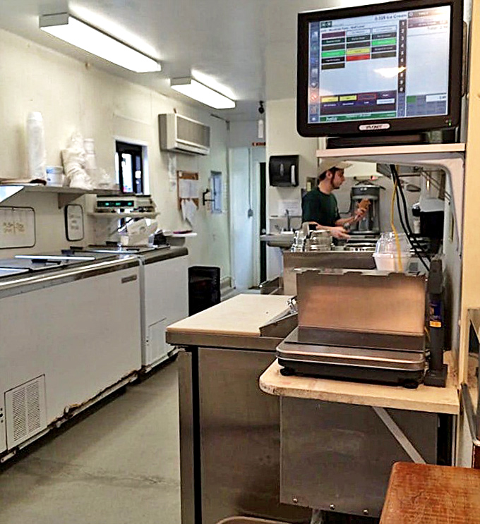 Behind this rustic wooden counter, dairy dreams come true. Seven generations of Jersey cow expertise transforms into creamy masterpieces daily.