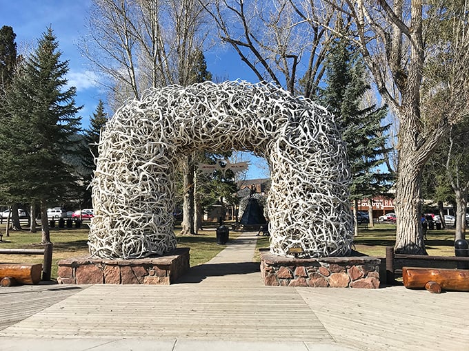 Thousands of naturally shed elk antlers form this iconic arch, proving nature creates the best photo ops.