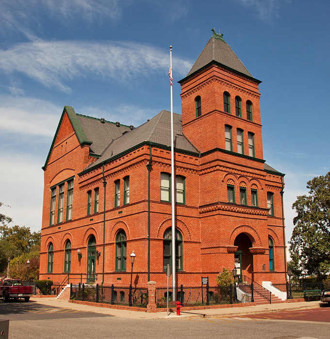The Jefferson Historical Museum stands as a brick sentinel of history, its Romanesque tower watching over the town like a Victorian time capsule come to life.