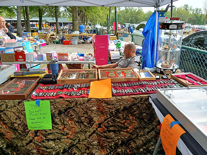 A vendor's careful display of pocket knives and collectibles tells stories of craftsmanship across generations. One person's collection becomes another's new obsession.