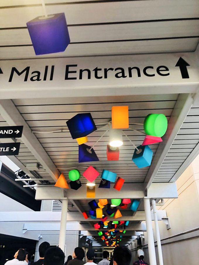 Those colorful ceiling cubes make shopping feel like walking through a modern art museum with better prices.