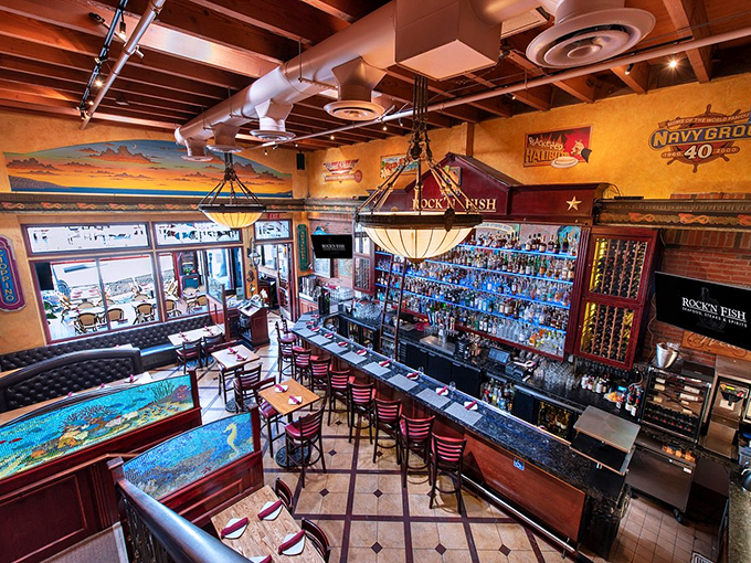 Step inside and the warm wood, exposed beams, and that magnificent bar create the perfect backdrop for seafood indulgence and cocktail contemplation.