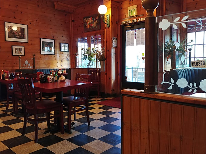 Warm wooden walls and that classic checkered floor create the perfect backdrop for breakfast magic&mdash;comfort wrapped in cabin-like coziness.
