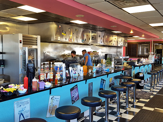 The counter seating at Angel's invites solo diners to belly up for conversation, coffee refills, and front-row views of short-order magic.