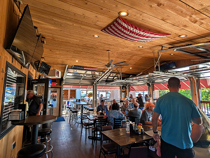 Wooden beams, garage doors that open to summer breezes, and tables filled with locals who know the secret. This isn't ambiance&mdash;it's authenticity.