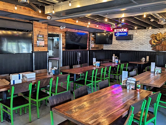 Those vibrant green chairs against rustic wooden tables create the perfect backdrop for the main event: the food that's about to change your day.