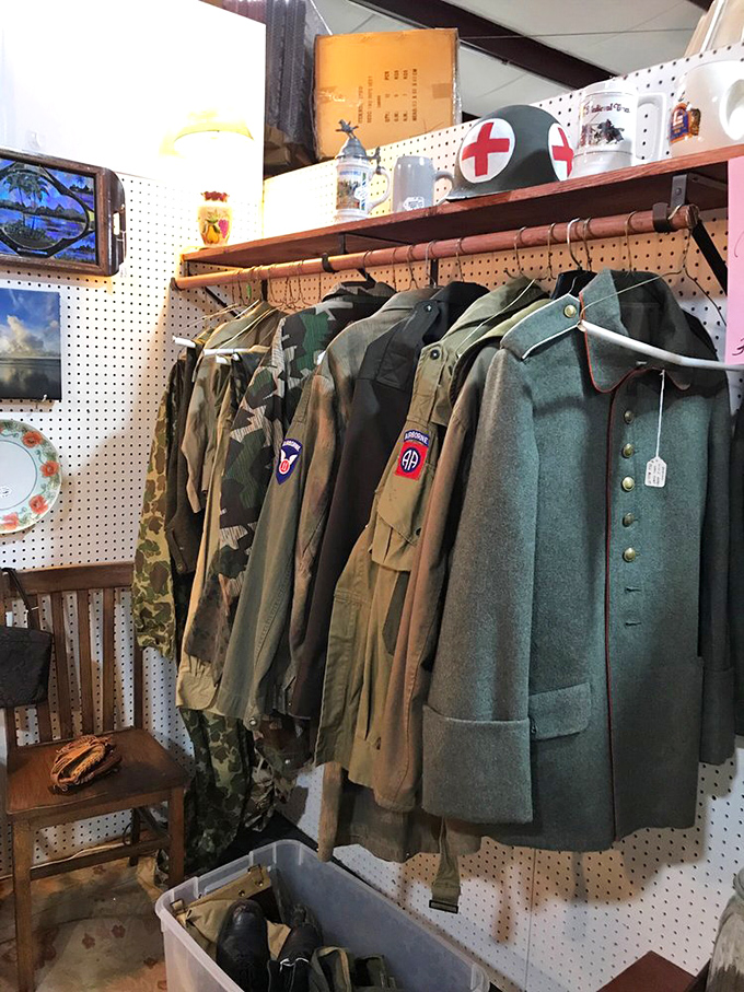 Military uniforms stand at attention, each patch and button telling silent stories of service, sacrifice, and the history they witnessed.