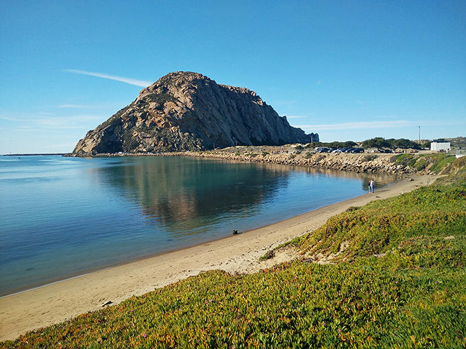 The perfect beach day doesn't exi&mdash; Oh wait, here it is! Morro Rock creates a dramatic backdrop for beachcombers enjoying California's pristine shoreline.