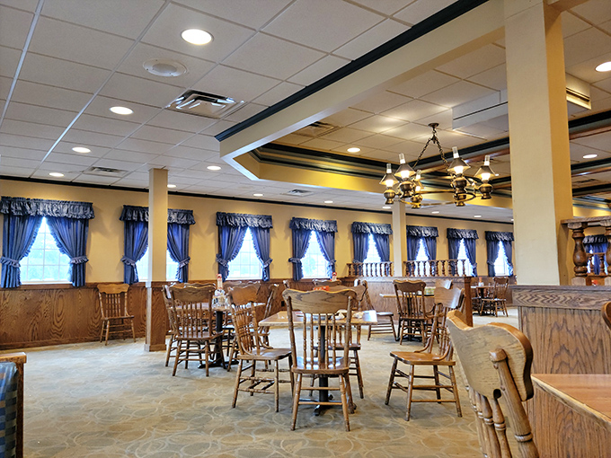Blue curtains, wooden chairs, and warm lighting create that "grandma's dining room" vibe where calories don't count and conversations flow freely.