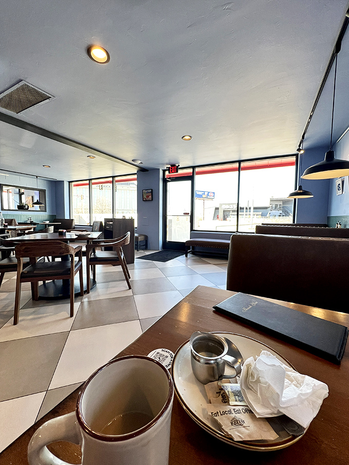 Blue walls and checkered floors create that perfect diner atmosphere where calories don't count and coffee refills are practically mandatory.