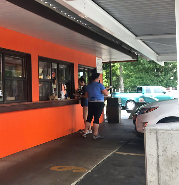 The ordering window: where anticipation builds and decisions are made. Will it be just root beer today, or are you going all-in with a coney dog too?