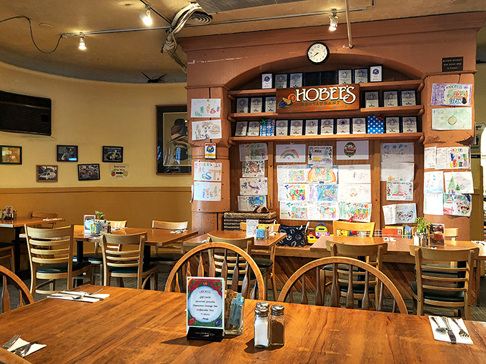 Inside Hobee's, wooden tables and chairs create the perfect backdrop for community connections, while children's artwork proves good taste starts young.