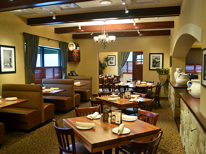 Warm woods, leather booths, and soft lighting create that "Nonna's fancy dining room" ambiance that makes every meal feel like Sunday dinner.