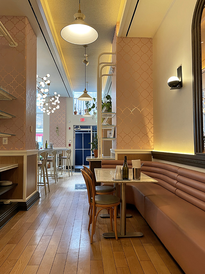 Blush walls and geometric patterns transport you straight to Tel Aviv, while those pendant lights create the perfect glow for food photography addicts.