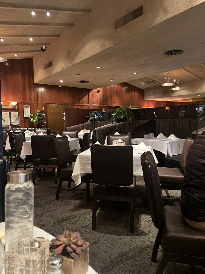 Rich wood paneling, white tablecloths, and leather booths create the perfect atmosphere for important conversations or celebrating life's victories, big and small.