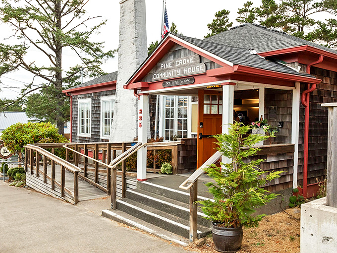 The historic Pine Grove Community House stands as Manzanita's beating heart, its rustic charm and welcoming porch inviting visitors to connect with local culture.