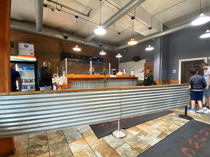 Industrial chic meets barbecue functionality at the ordering counter. That corrugated metal has witnessed countless barbecue dreams come true.