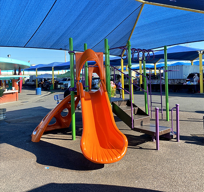 That beautiful orange slide isn't just for show&mdash;it's your secret weapon for keeping kids happy while you hunt for deals.
