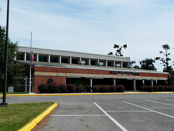 The local post office stands as a testament to mid-century architecture and the enduring miracle of birthday cards arriving exactly one day late.