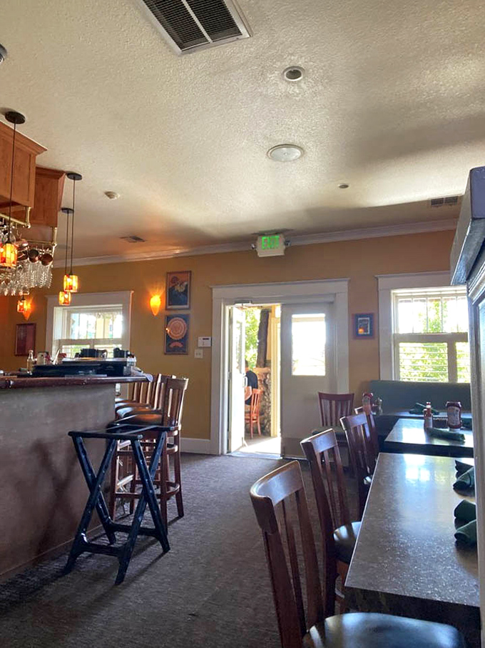 Warm wood tones and amber lighting create the perfect backdrop for morning conversations or solo dining adventures at the welcoming bar.