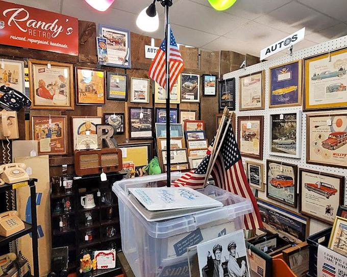 Randy's Retro booth is a time capsule of automotive Americana, where vintage car ads and patriotic flair transport you to drive-ins and Sunday cruises.