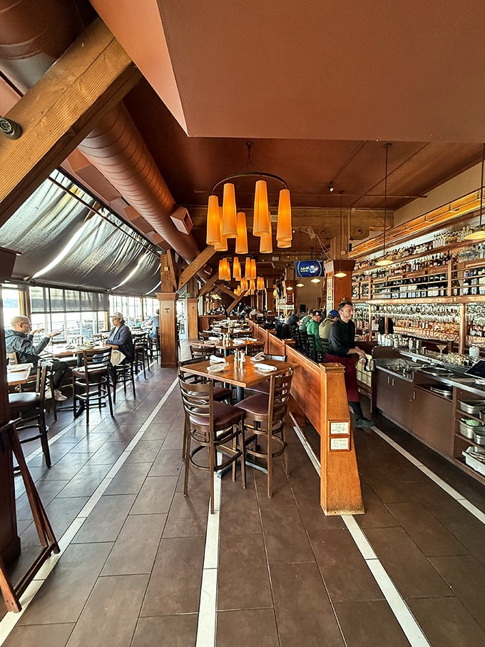 Warm wood tones and amber lighting create the perfect mood for seafood indulgence &ndash; like a hug from the ocean itself.