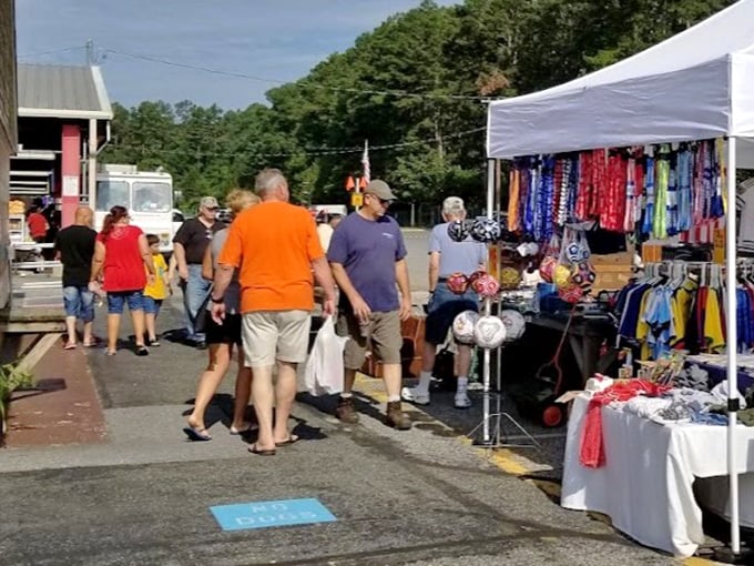 The art of the browse in full swing. Shoppers sift through colorful clothing displays, where yesterday's fashion becomes tomorrow's vintage find.