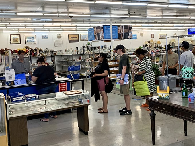 Bargain hunters in their natural habitat. Notice the focused expressions&mdash;that's the look of people who've just spotted vintage Pyrex at yard sale prices.