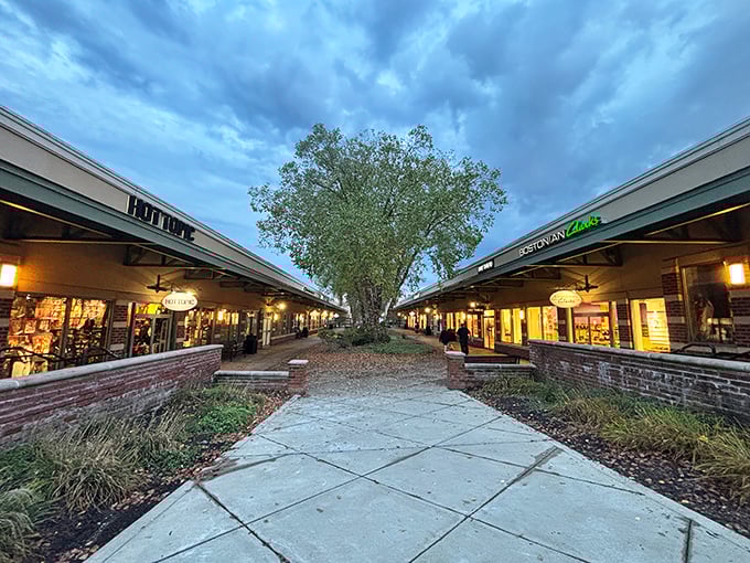 Twilight shopping takes on a magical quality as stores illuminate the pathway. This isn't just retail therapy—it's a full wellness retreat.