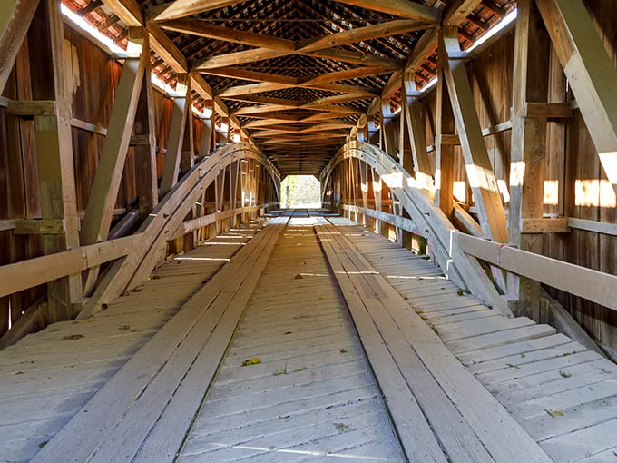Step inside and marvel at the intricate wooden skeleton that's been holding strong for over a century. Engineering poetry in timber and tenacity.