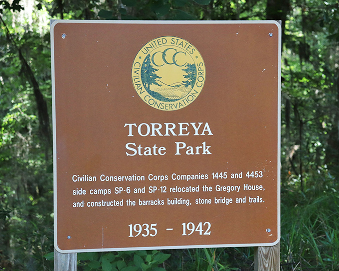 History carved in wood and metal. This sign reveals the park's Depression-era origins when the CCC transformed this wilderness into the gem we enjoy today.