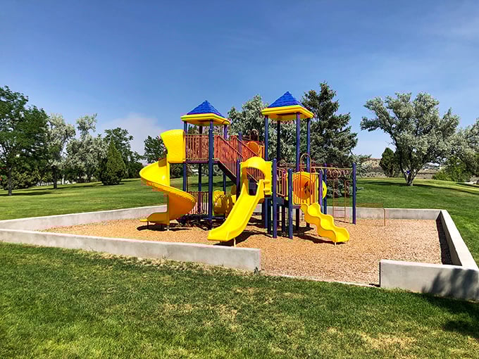 Who says playgrounds are just for kids? This sunny park offers the perfect excuse to reconnect with your inner child while grandkids do the sliding.