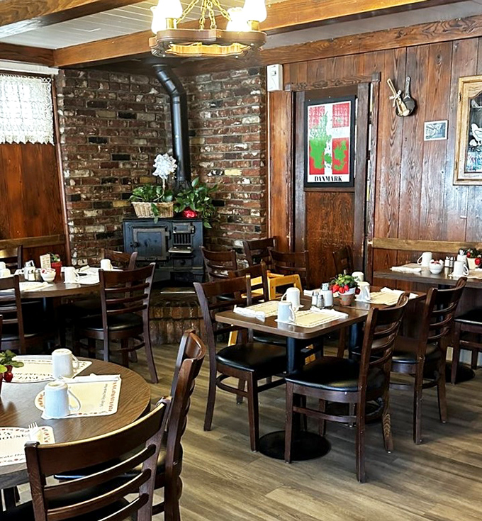 Exposed brick, wooden beams, and that vintage stove—this isn't Danish design from an IKEA catalog, it's the real, lived-in deal.