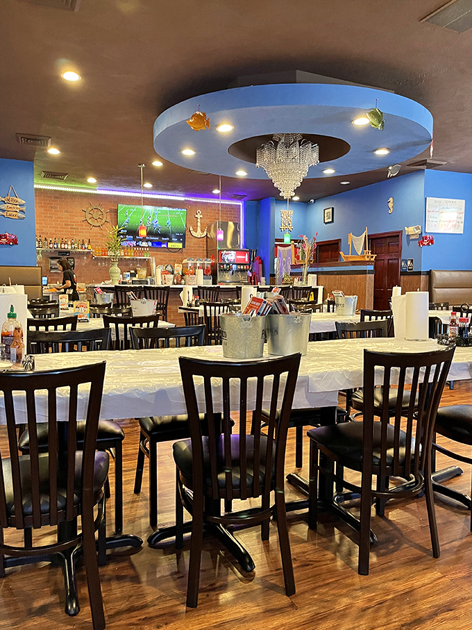 Blue walls, nautical decor, and that unexpected crystal chandelier create a space that's both casual and special. The ocean vibe is strong in this desert oasis.