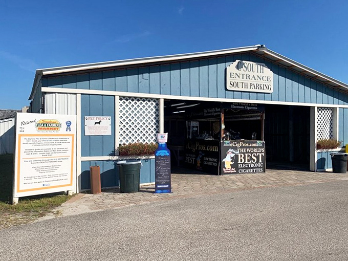Florida's blue skies welcome shoppers at the South Entrance, where weekend adventures begin and wallets tremble with anticipation.