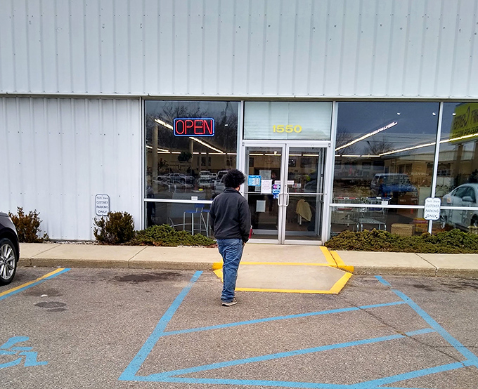 The moment of anticipation! That glowing "OPEN" sign is the portal to a parallel universe where yesterday's discards become tomorrow's treasures.