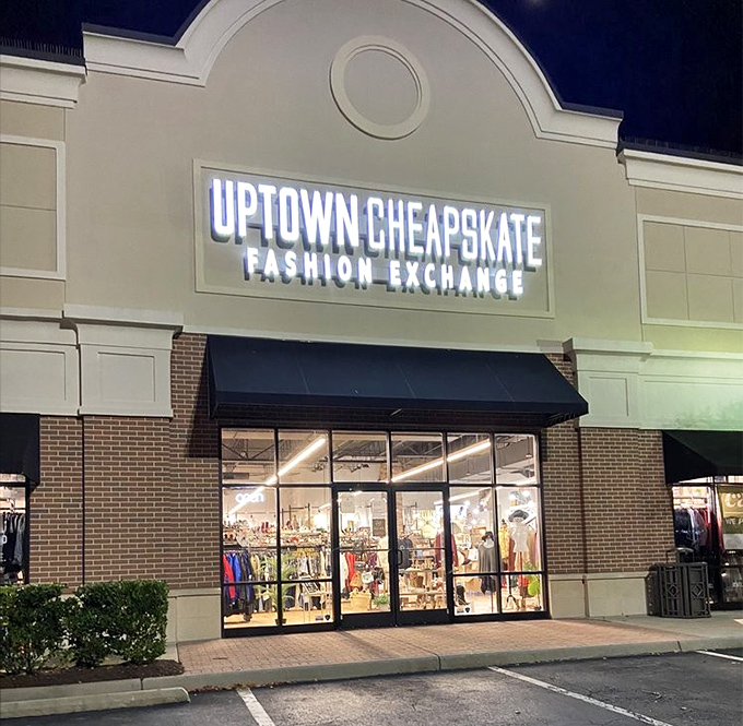 By day, a beacon for bargain hunters; by night, a glowing reminder that tomorrow's designer outfit is waiting inside.